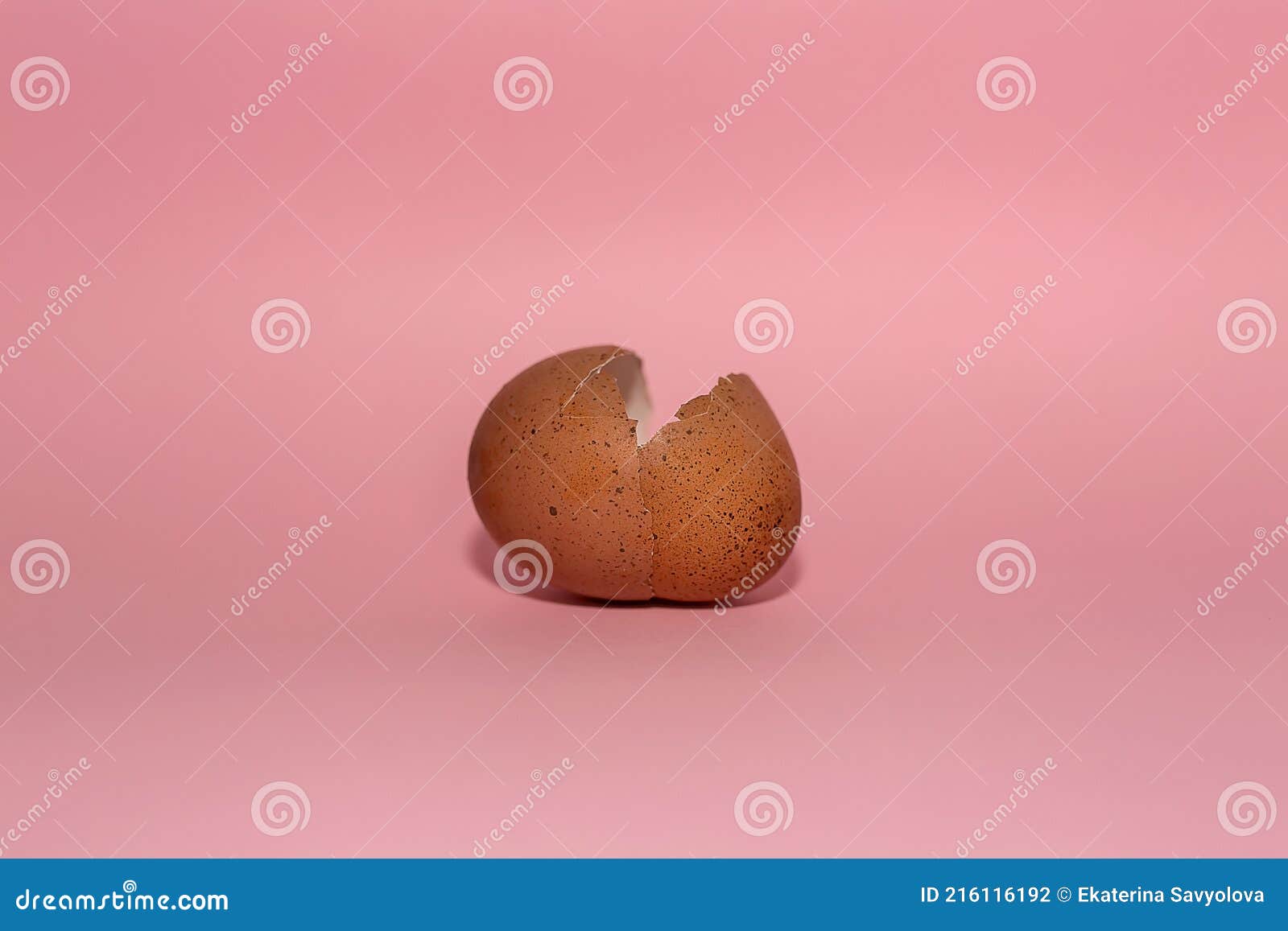A Broken Chicken Egg. Egg Shell on a Pink Background. Stock Photo ...