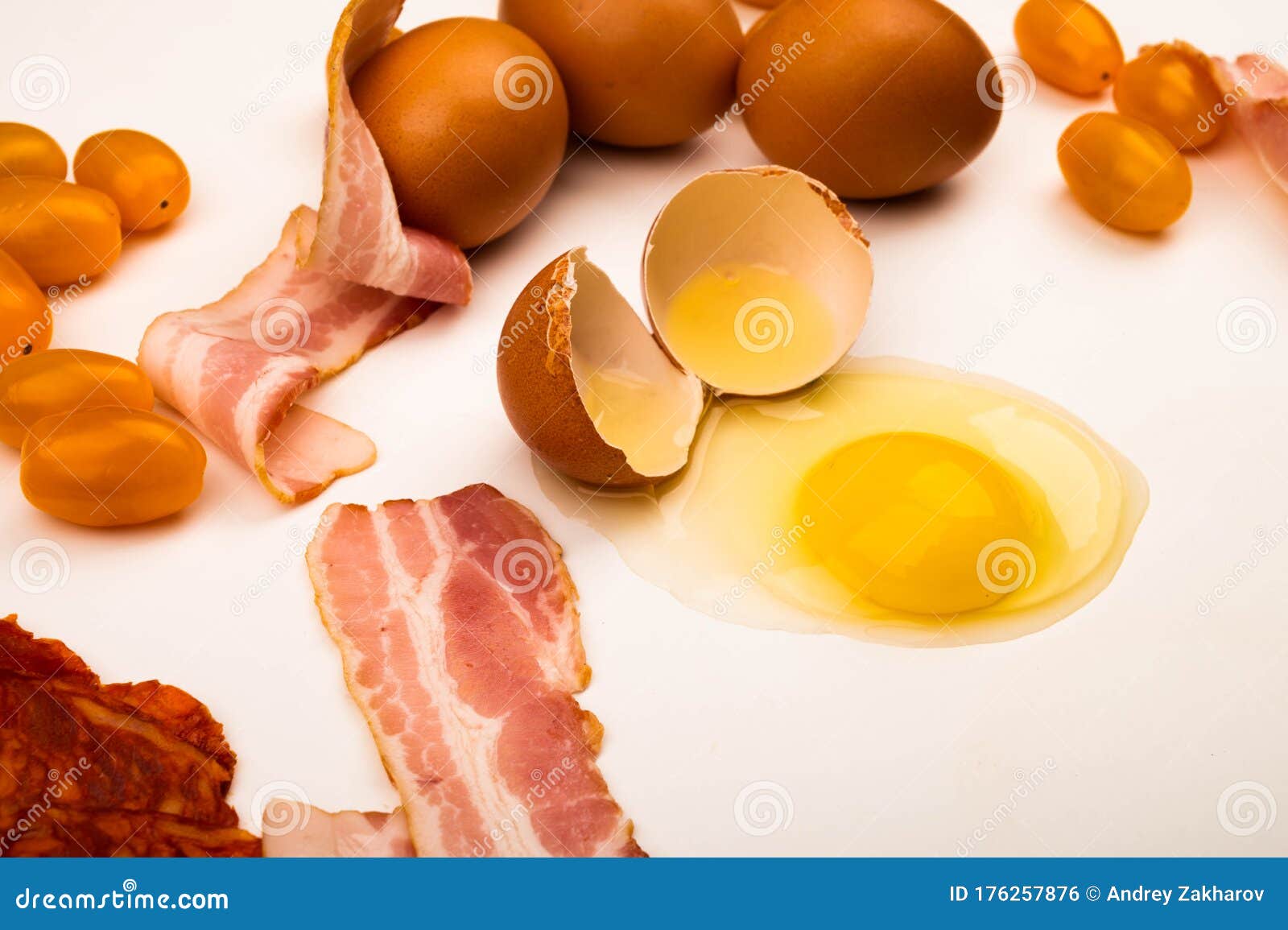 Broken Chicken Egg, Scattered Chicken Eggs, Tomatoes and Slices of ...