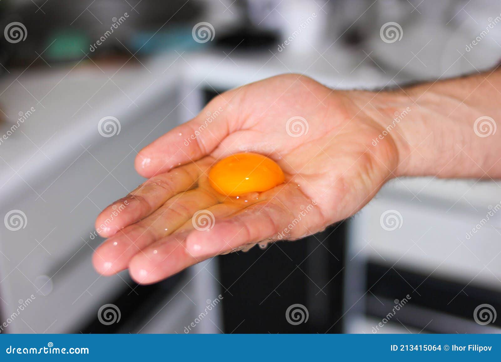 Broken Chiken Raw Egg without Shell in a Man`s Hand. Close-up View ...