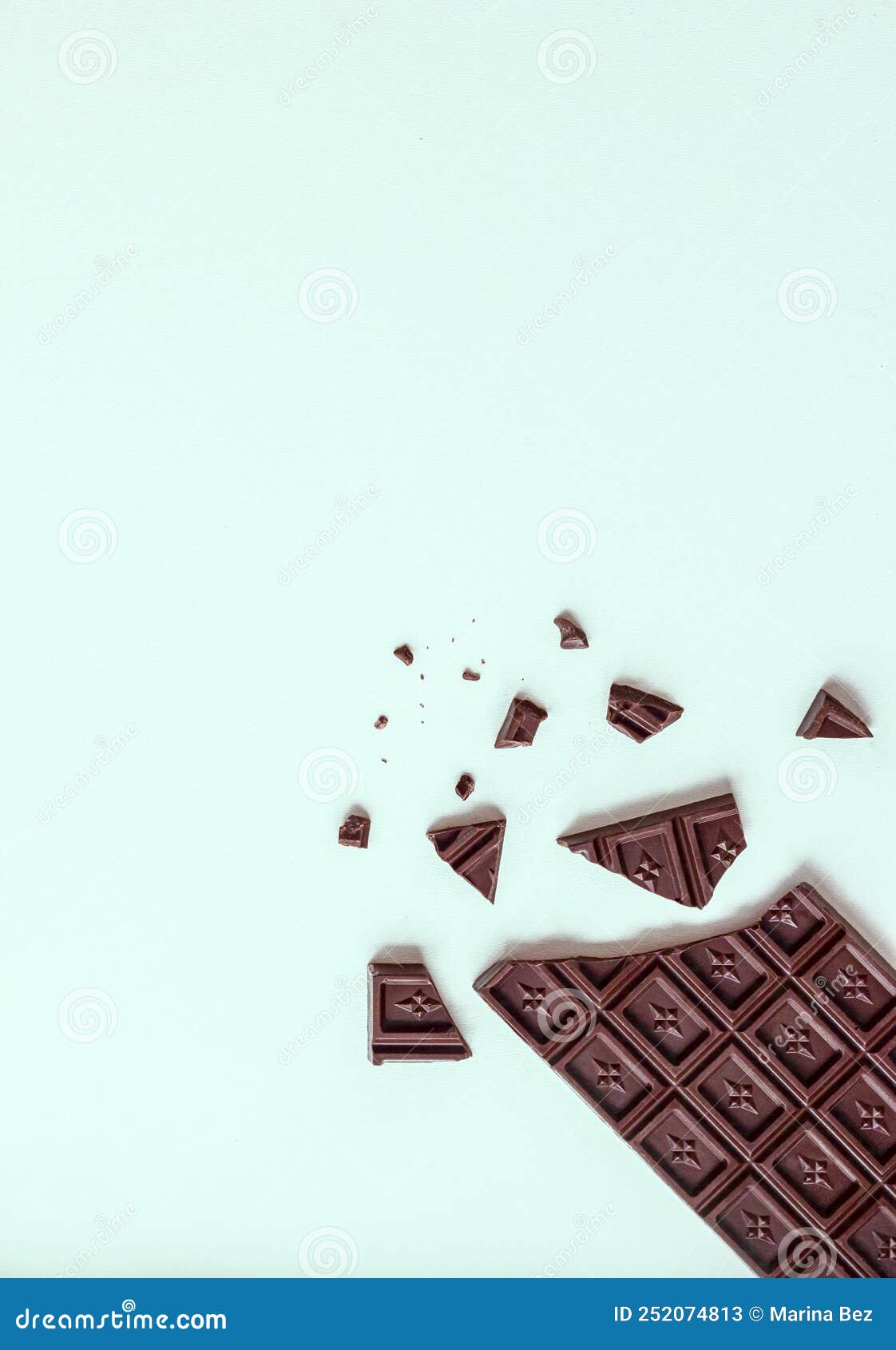 Broken Chocolate Bar on the Blue Background with Copy Space Stock Image ...