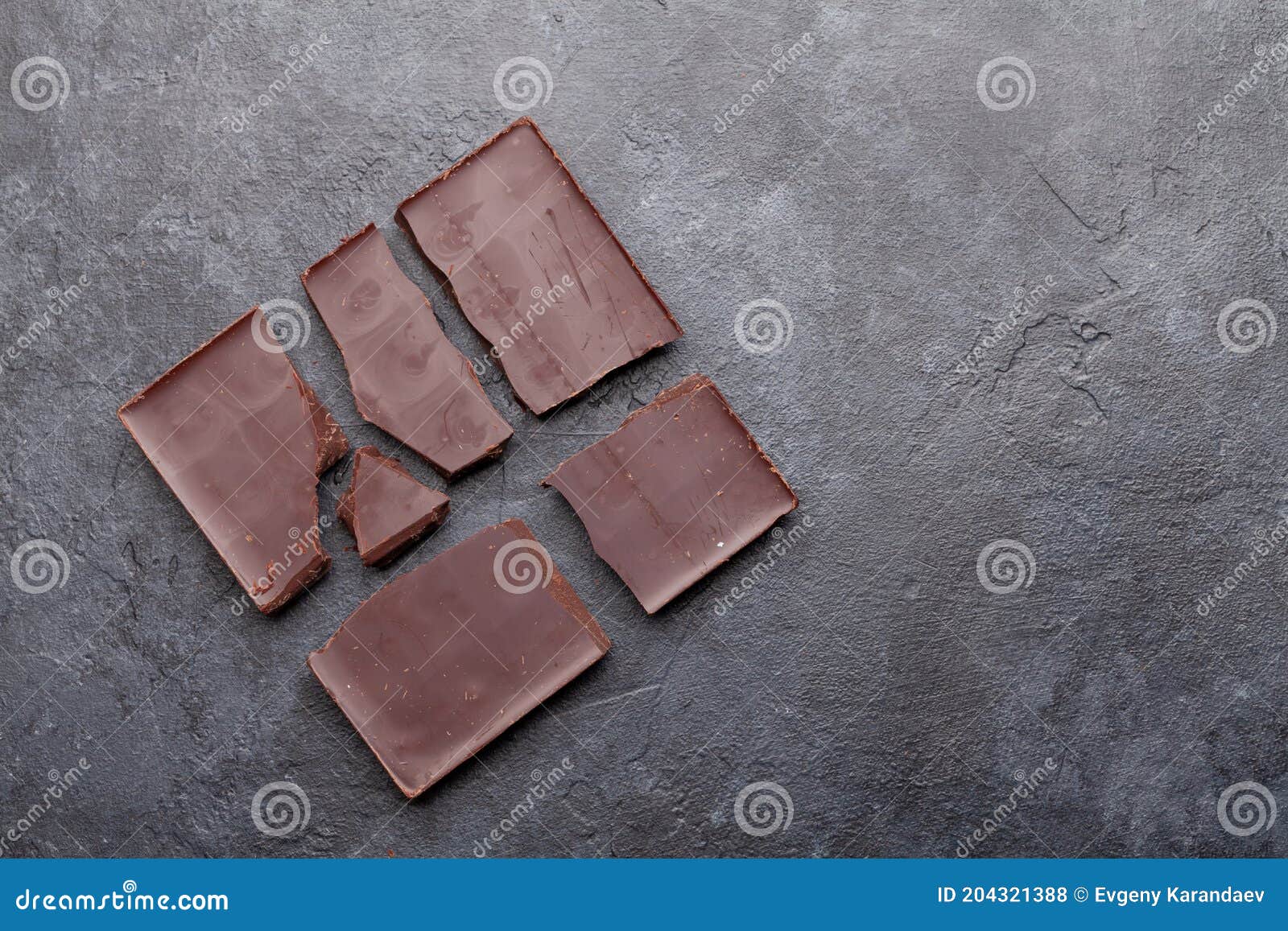 Broken chocolate bar stock photo. Image of slice, dark - 204321388