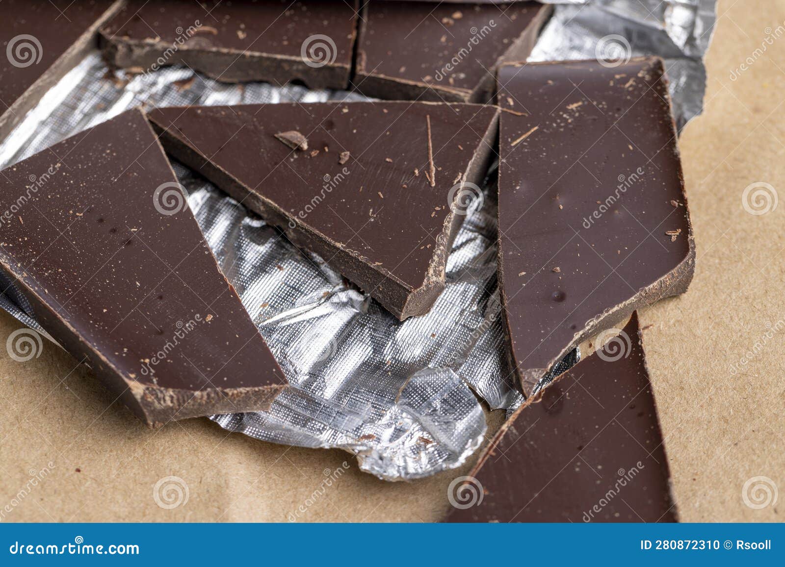 A Broken Chocolate Bar in a Paper and Foil Package Stock Photo - Image ...