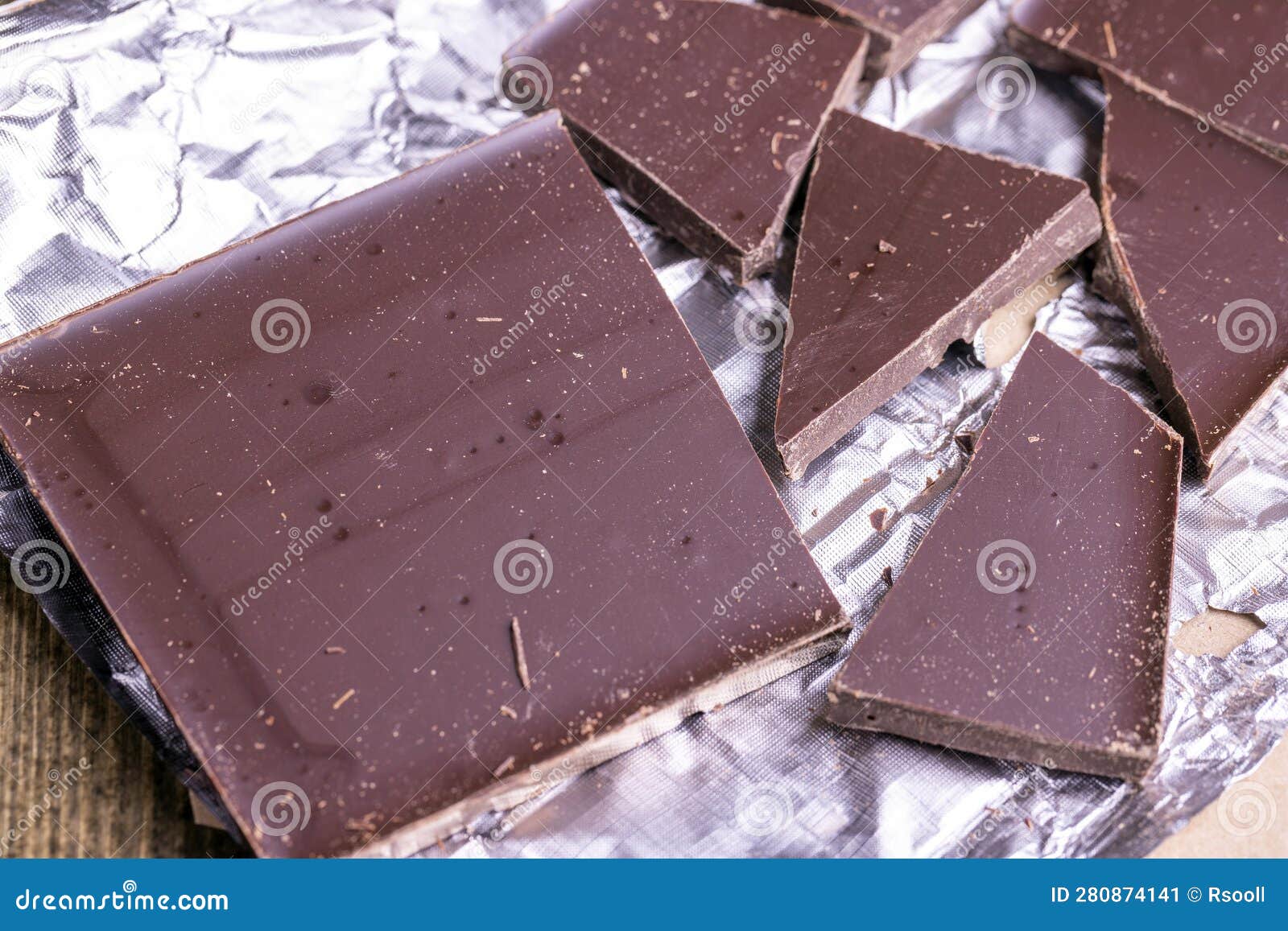 A Broken Chocolate Bar in a Paper and Foil Package Stock Image - Image ...