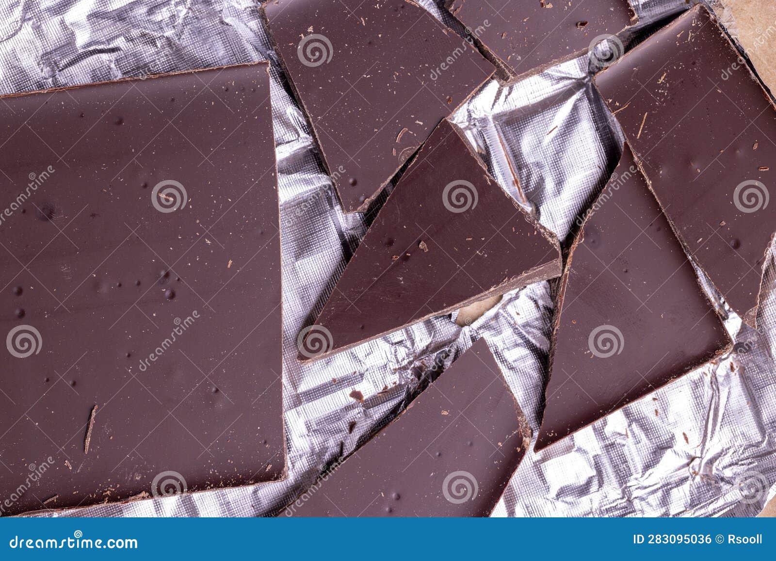 A Broken Chocolate Bar in a Paper and Foil Package Stock Photo - Image ...