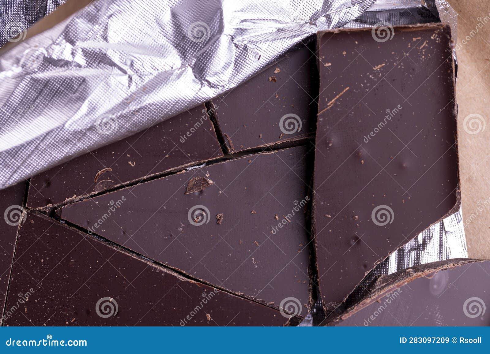 A Broken Chocolate Bar in a Paper and Foil Package Stock Image - Image ...