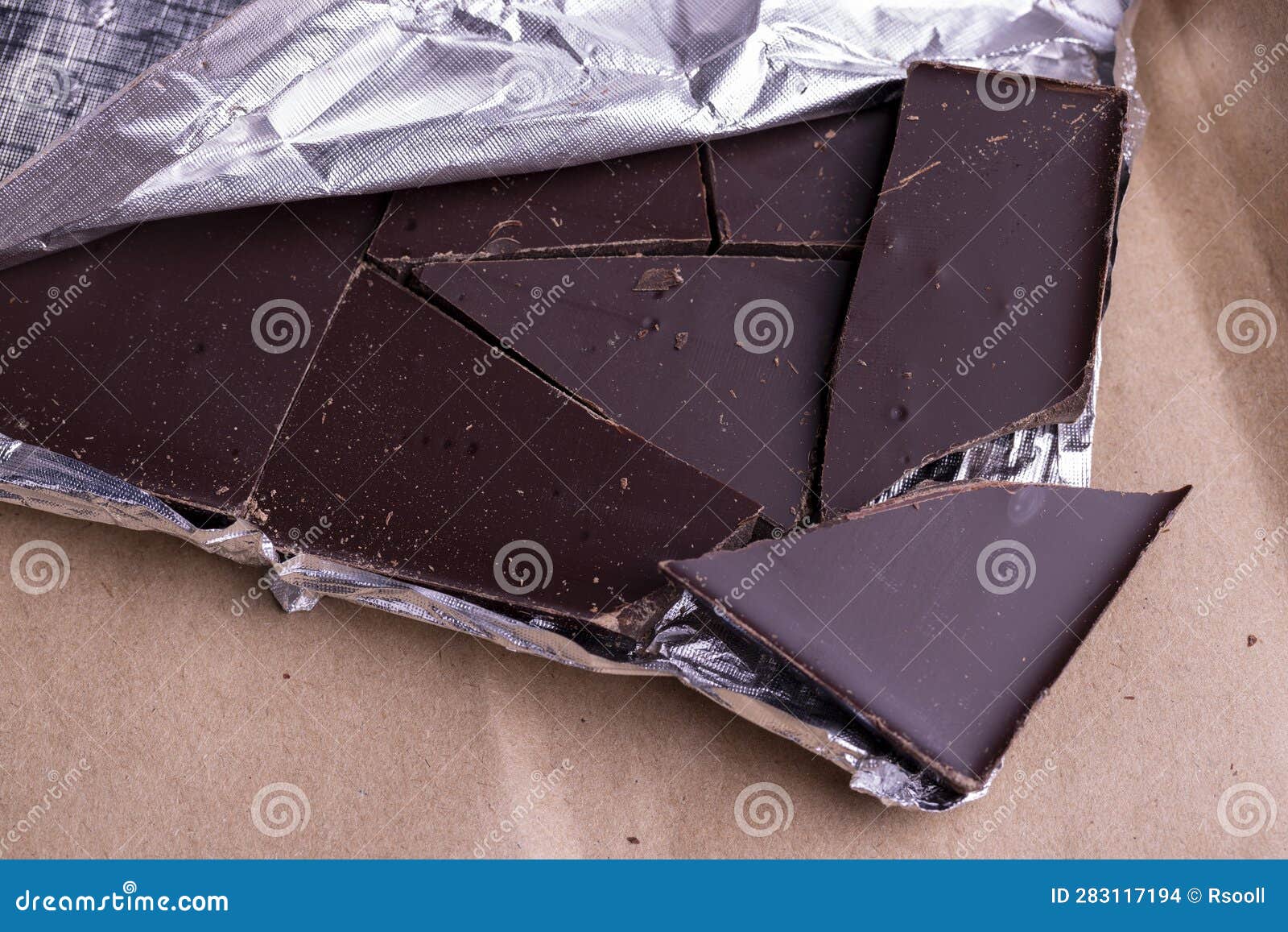 A Broken Chocolate Bar in a Paper and Foil Package Stock Photo - Image ...