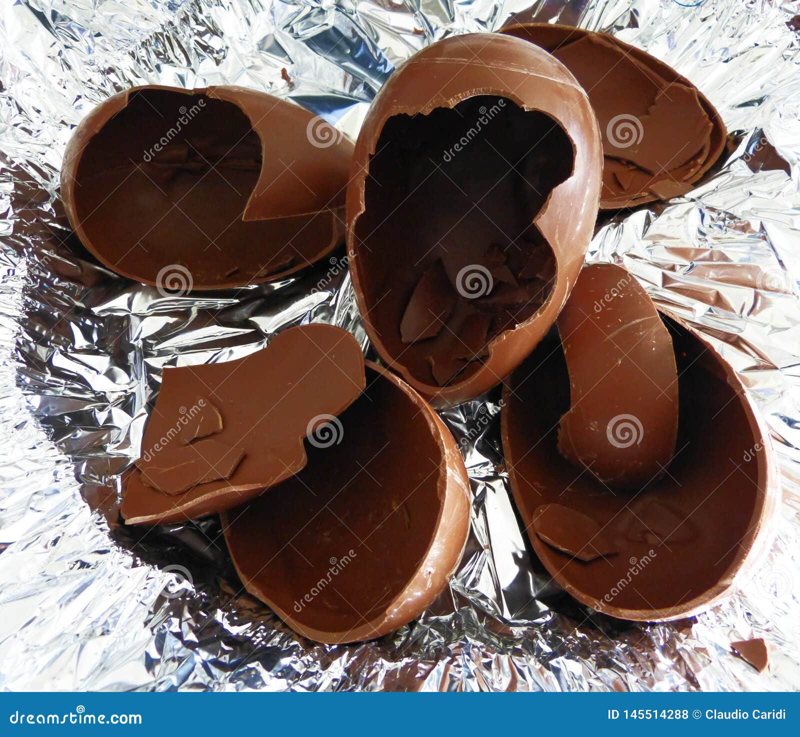 Broken Chocolate Easter Egg on a Foil Sheet Stock Photo - Image of ...