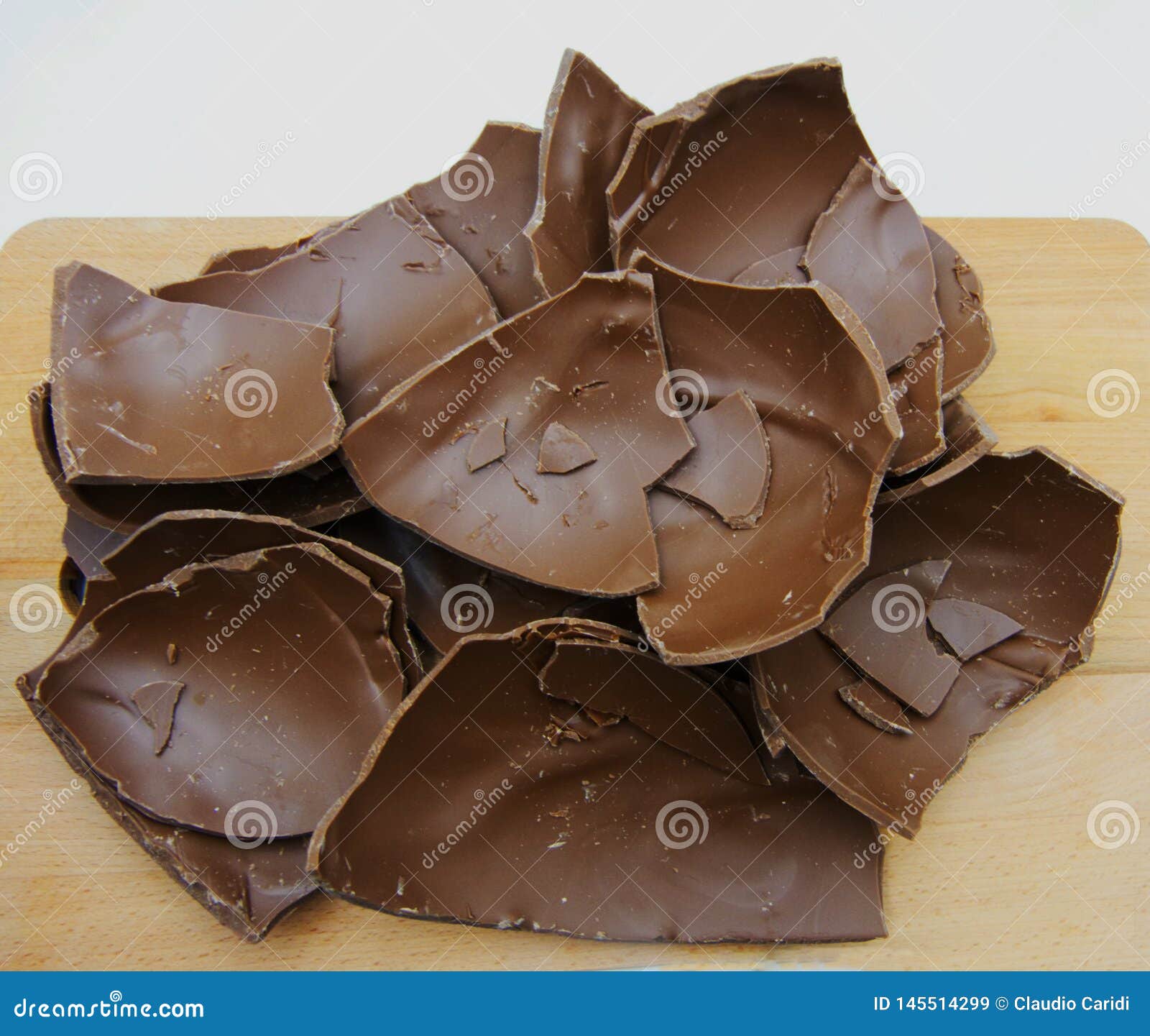 Broken Chocolate Easter Egg on a Wooden Table Stock Image - Image of ...