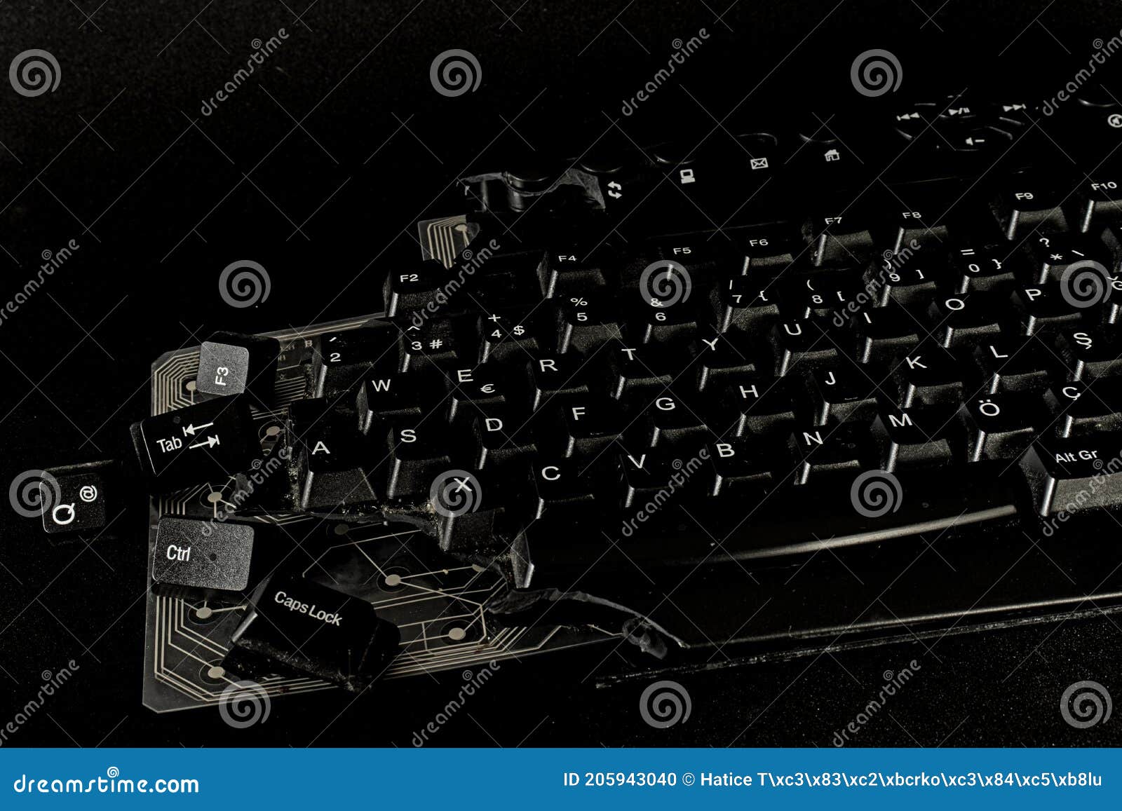 A Broken Computer Keyboard Isolated on Black Stock Photo - Image of ...