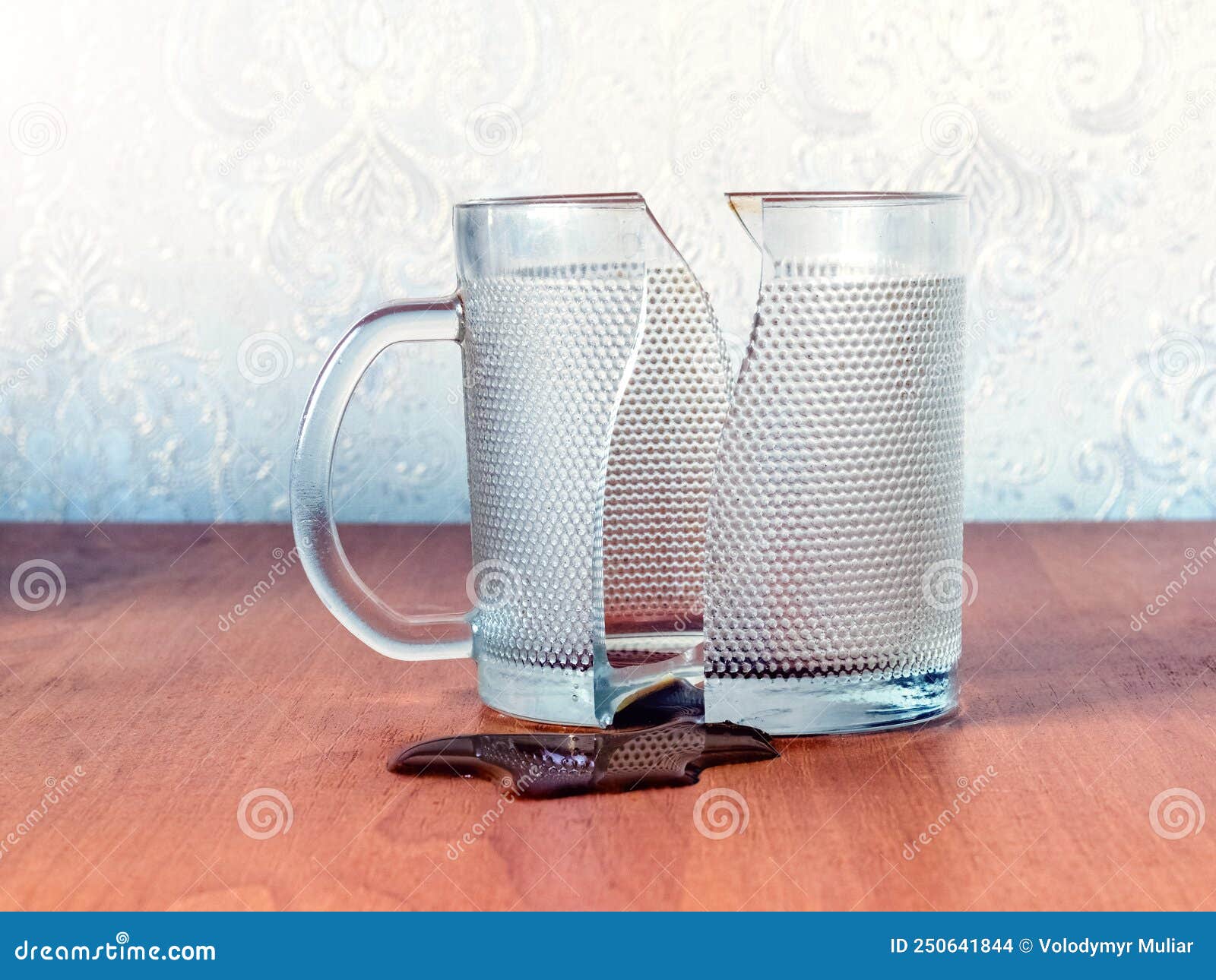 Broken Cup and Spilled Coffee or Tea in the Office on the Table Stock ...