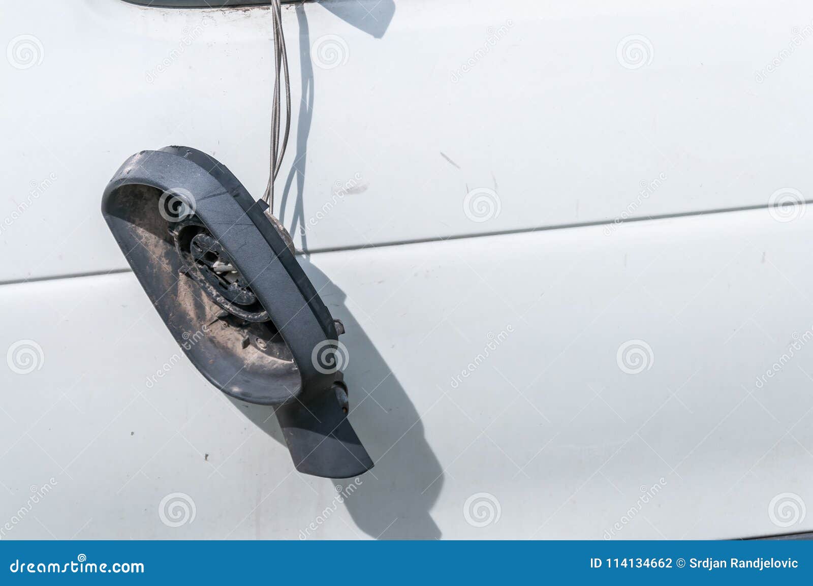 Broken and Damaged Side Mirror on the Car Doors with Remaining Wires ...