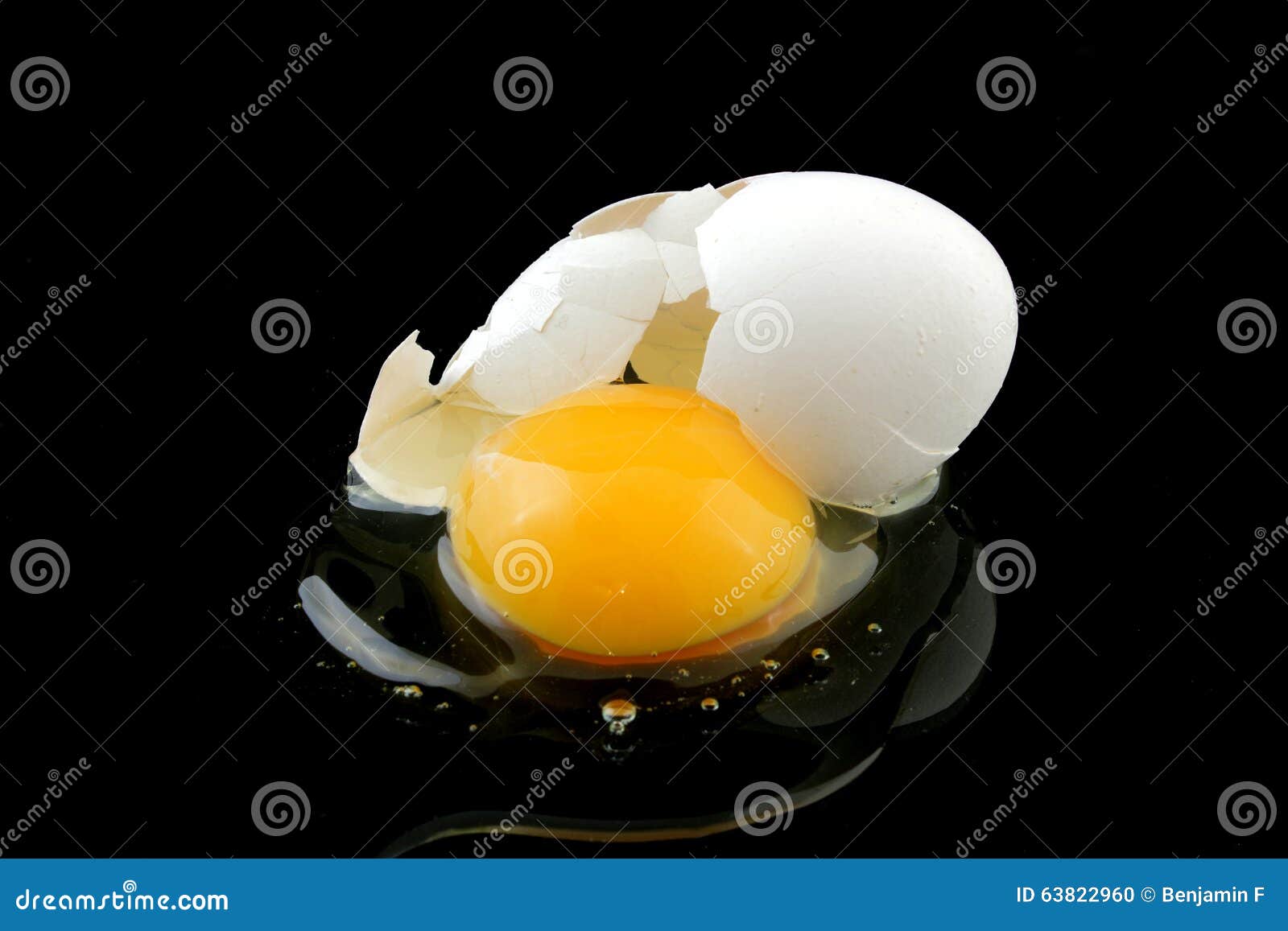 Broken egg on black stock photo. Image of crack, crushed - 63822960