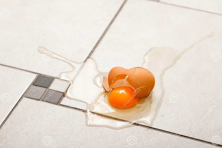 Broken egg on the floor stock photo. Image of messy, failure - 17280604