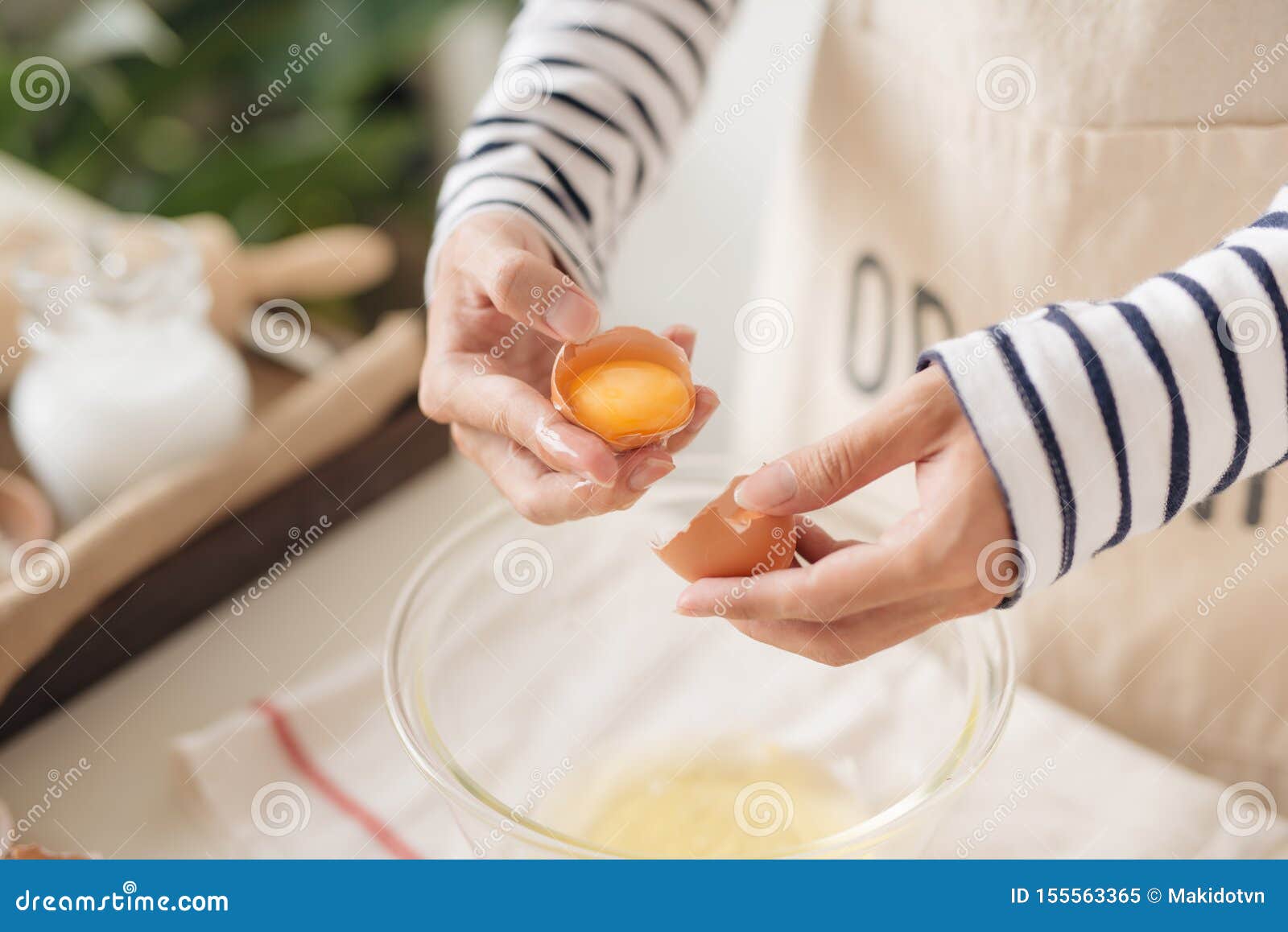 Broken Egg in Hands with Separated Yolk Closeup Stock Image - Image of ...