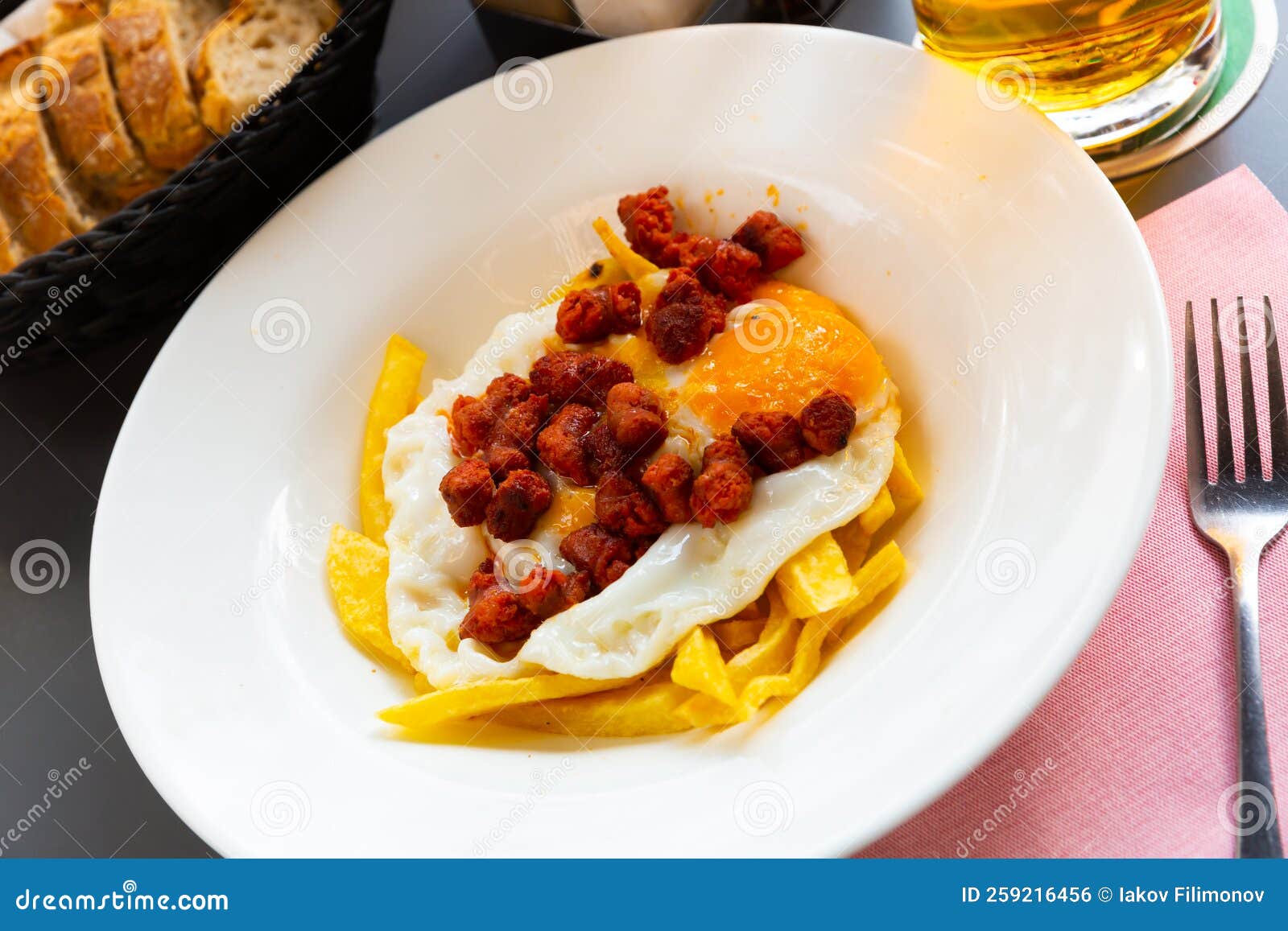 Broken eggs with chistorra stock photo. Image of chistorra - 259216456