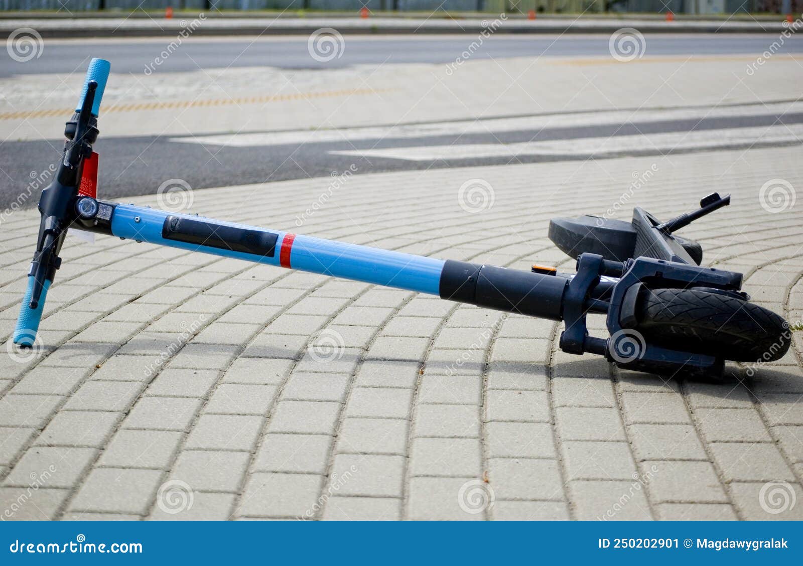 Broken Electric Scooter Lying on the Sidewalk Stock Image - Image of ...