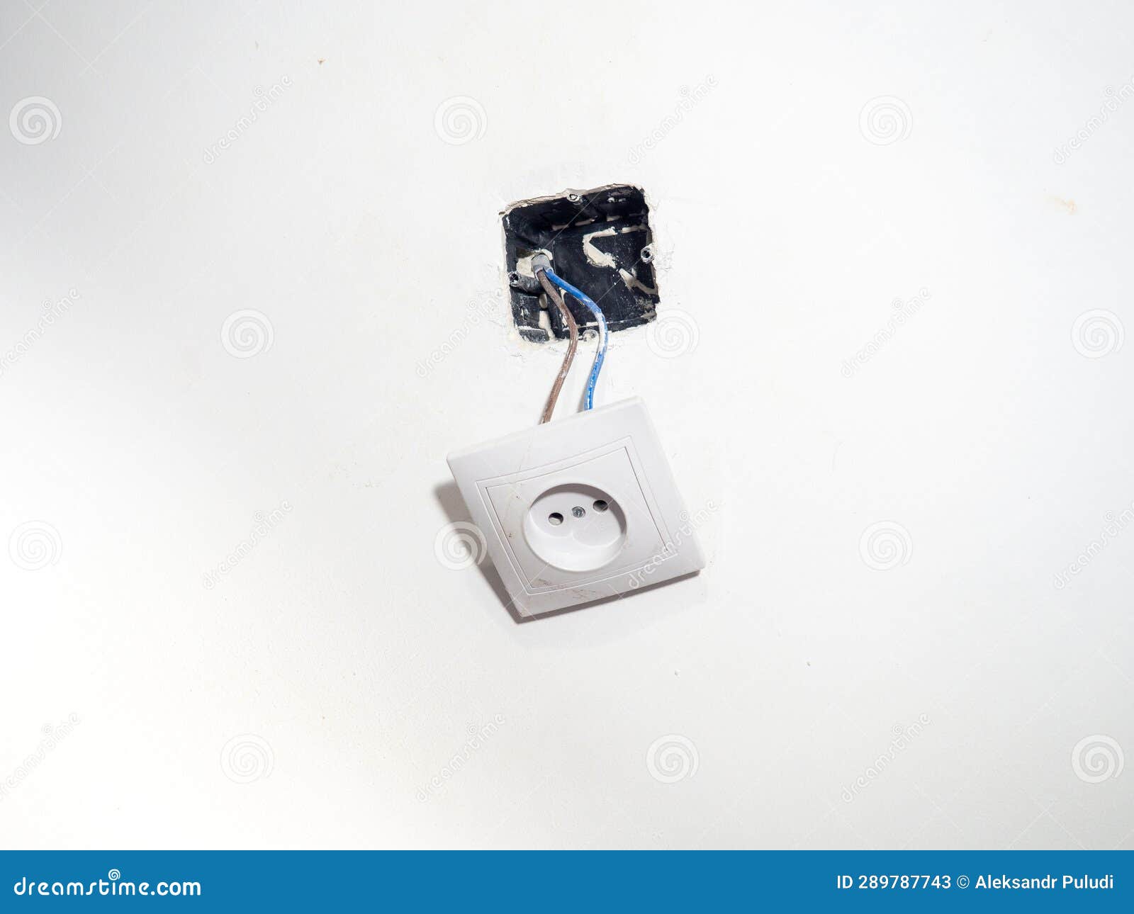 Broken Electrical Socket on the Wall. Disassembled Device. White Wall ...