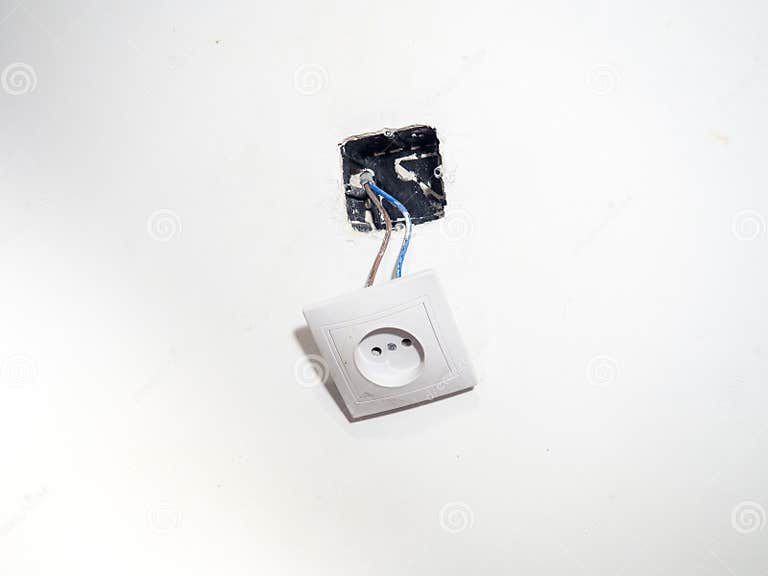 Broken Electrical Socket on the Wall. Disassembled Device. White Wall ...