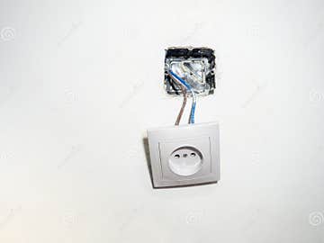 Broken Electrical Socket on the Wall. Disassembled Device. White Wall ...
