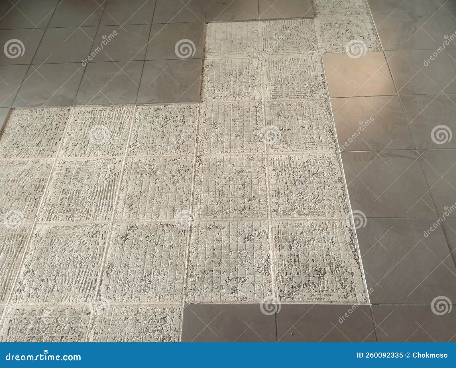 Broken floor tiles stock image. Image of tiler, laying - 260092335
