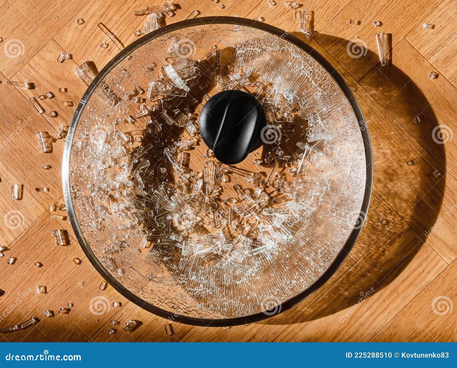 Broken Frying Pan Lid Falling To the Floor. Stock Photo - Image of ...