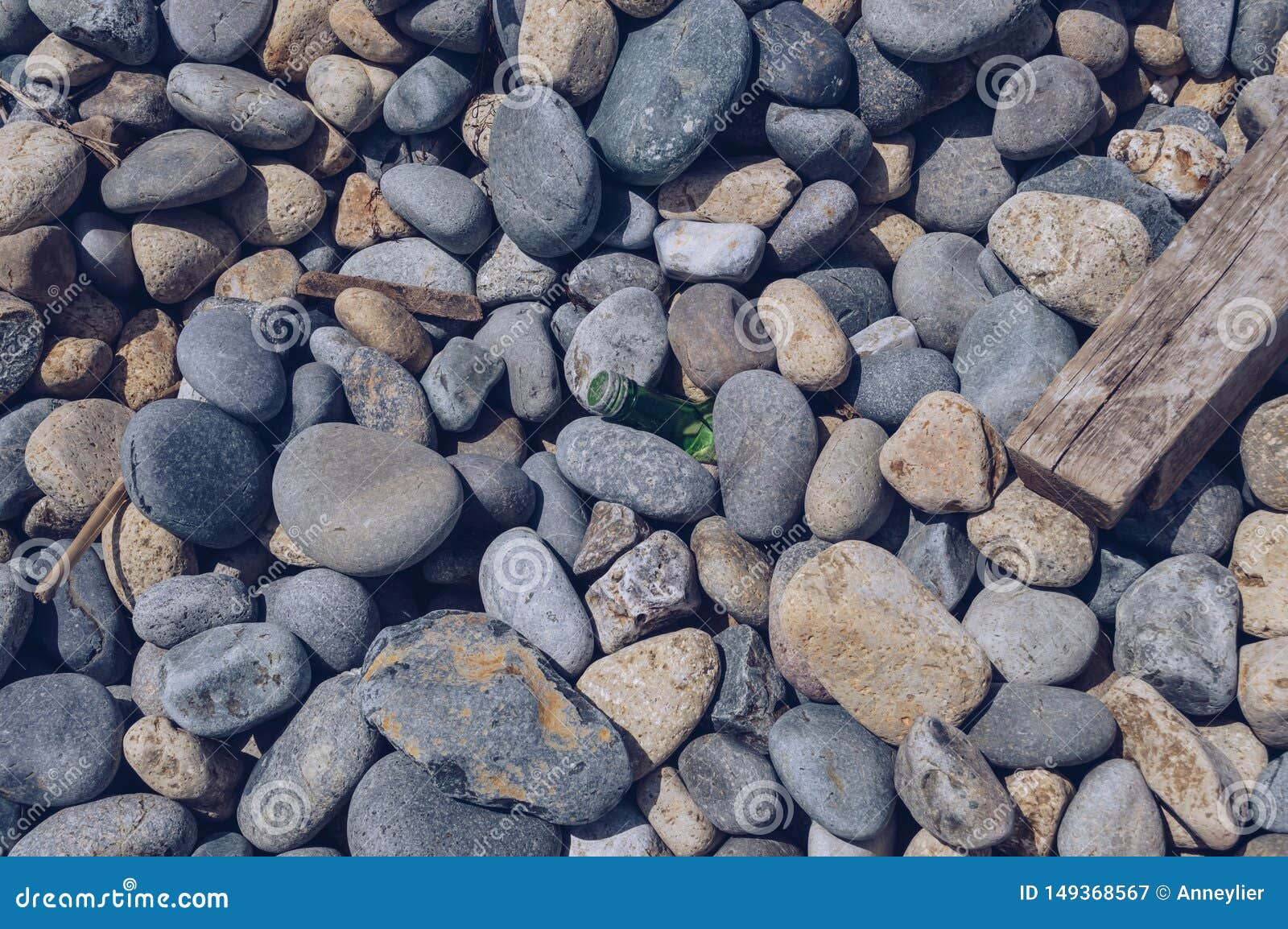 Broken Glass Bottle Inside of Pebbles on the Beach Stock Image - Image ...