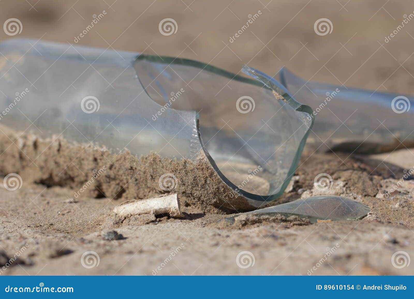 Broken Glass Bottle in the Sand Stock Photo - Image of crushed, edge ...