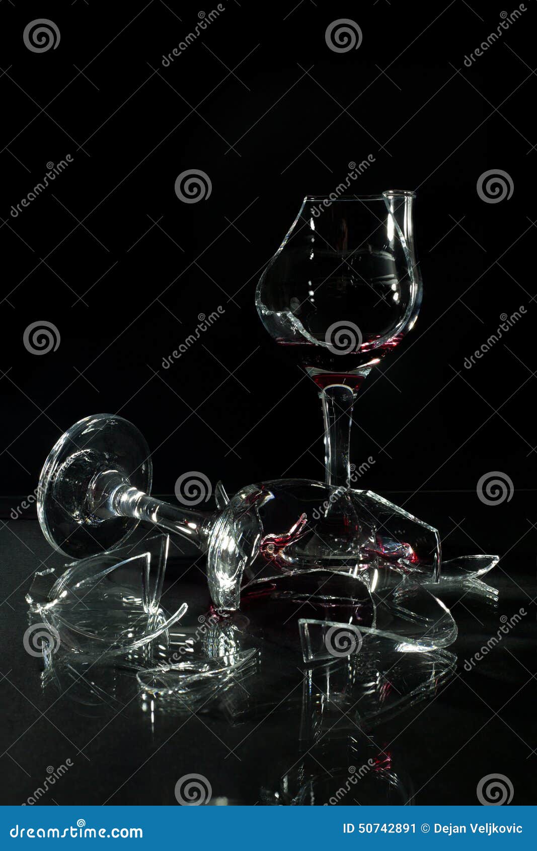 Broken Glass Cups with Reflection on a Glass Table Isolated on Black ...