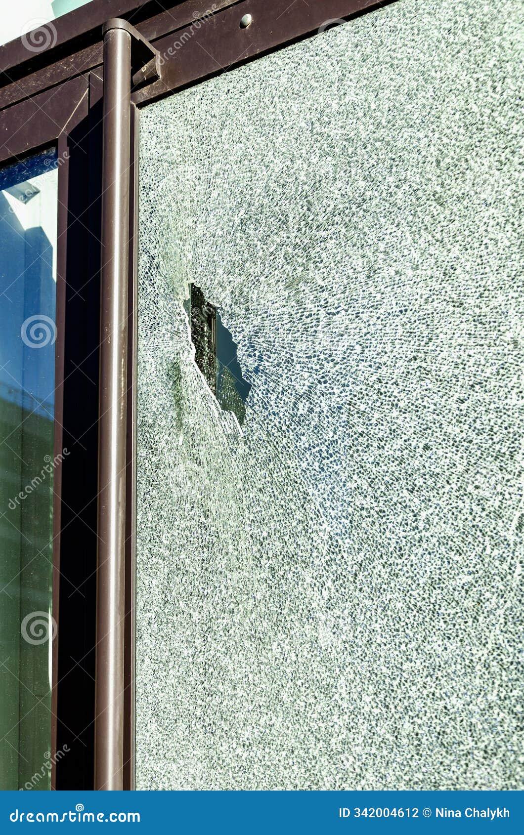 Broken Glass. Hole in the Tempered Glass of Front Door Stock Photo ...