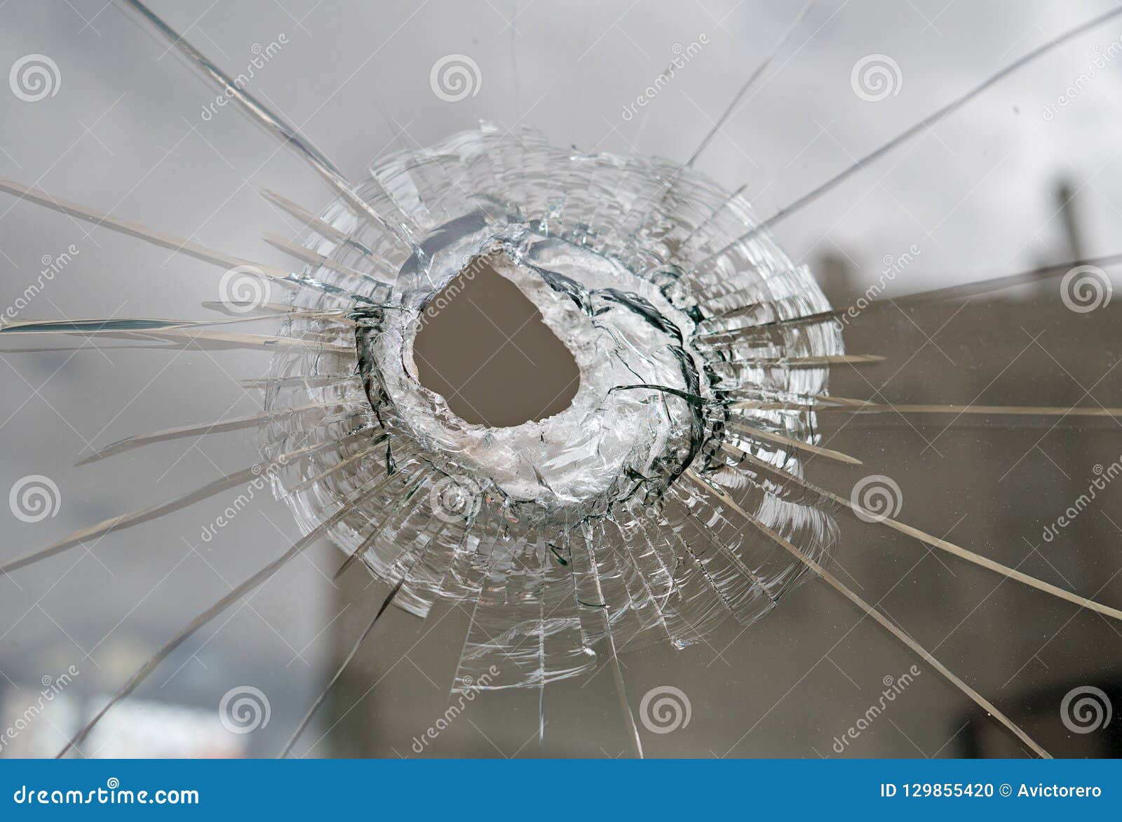 Broken glass with hole stock photo. Image of black, shot - 129855420