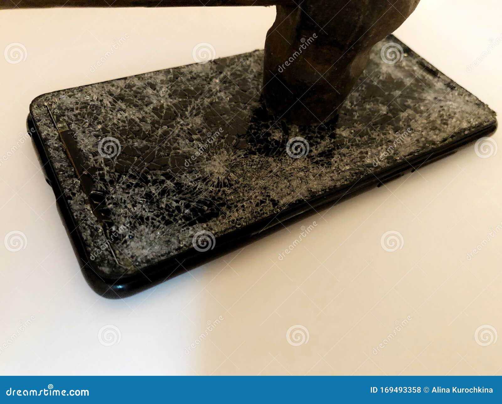 Broken Glass Mobile Phone on a White Background. Hammer Beating on the ...