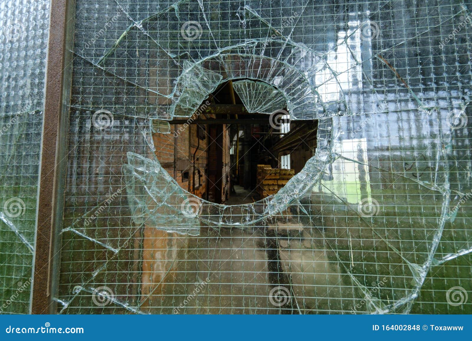 Broken Glass in the Window of Warehouse Stock Photo - Image of crushed ...