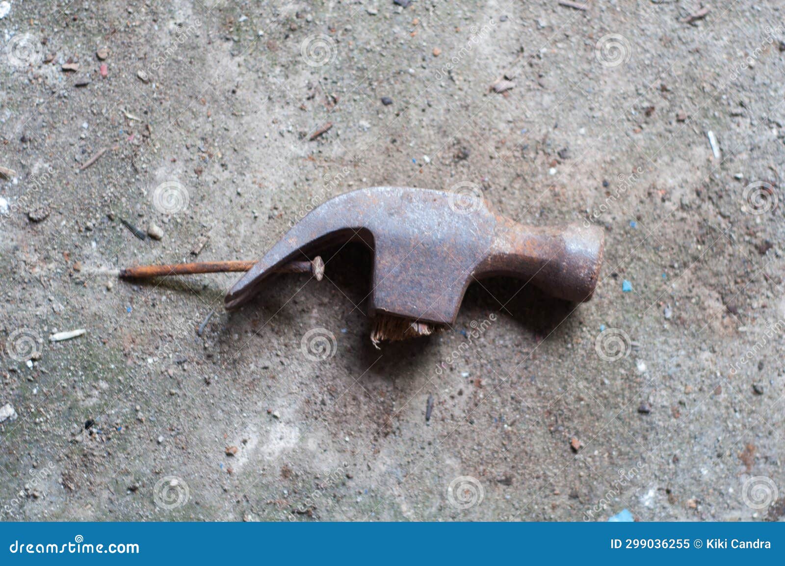 A Broken Hammer with No Handle on a Gray Abstract Textured Cement ...