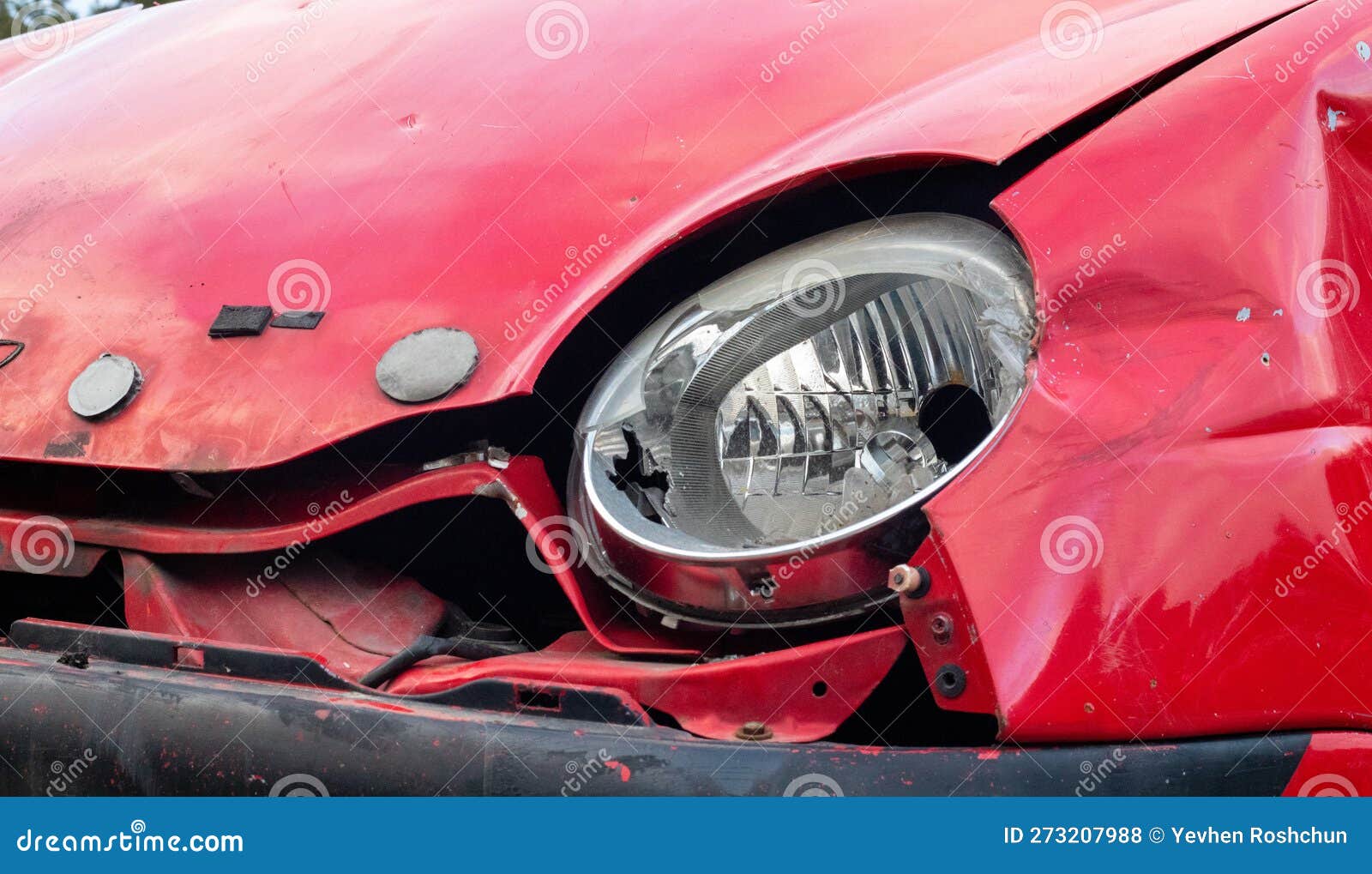 Broken Headlight of a Red Car after a Severe Accident with a Skewed ...