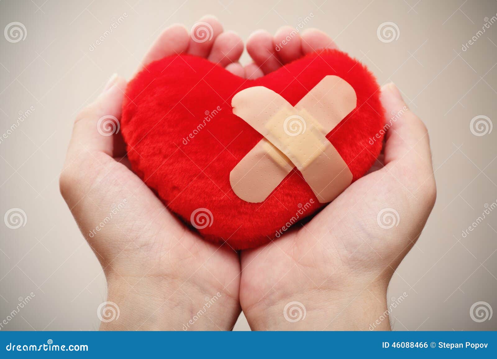 Bandaged Heart In Hands