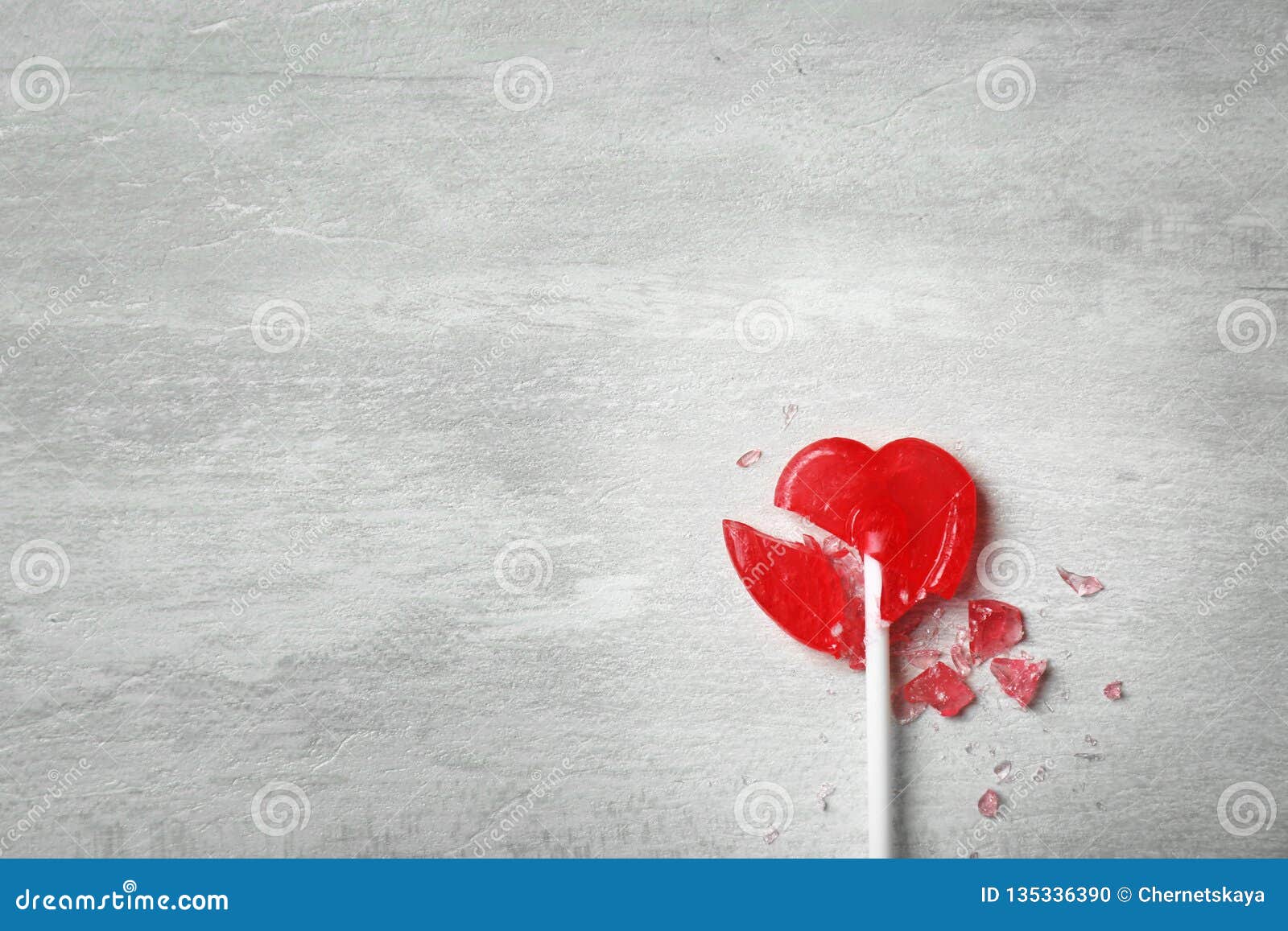 Broken Heart Shaped Lollipop on Gray Background, Top View with Space ...