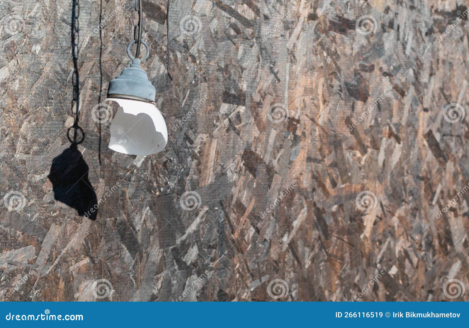 Broken Lantern with Shadow on Wall in Bright Sunlight Stock Image ...
