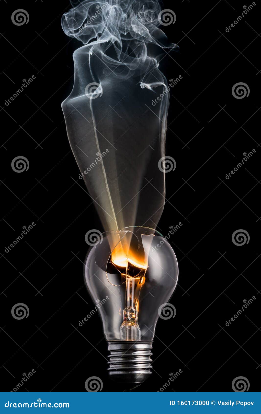 Broken Light Bulb and Smoke from a Burning Spiral on a Black Background ...