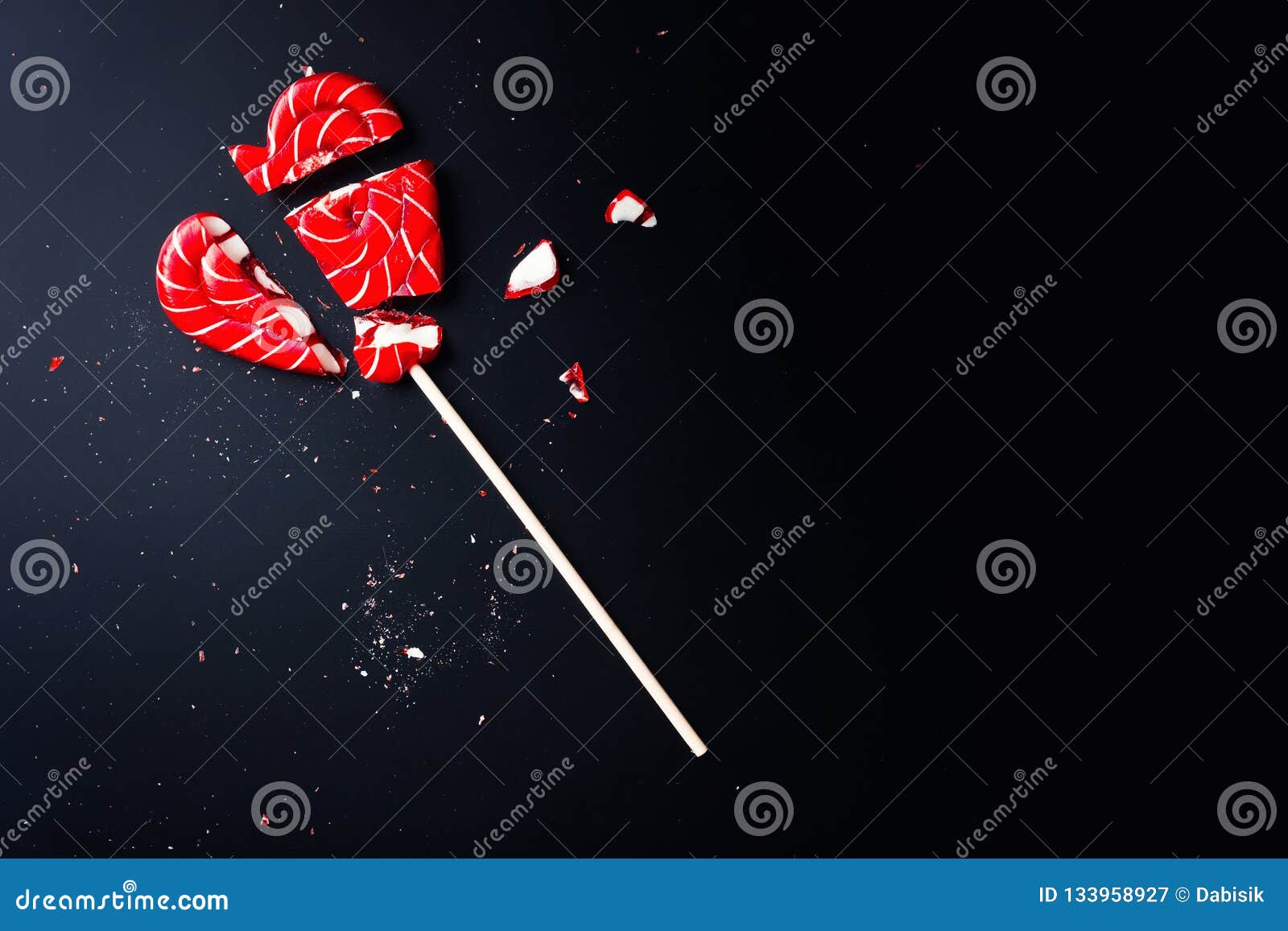 Broken Lollipop in Shape of Heart on a Dark Background with Copy Space ...