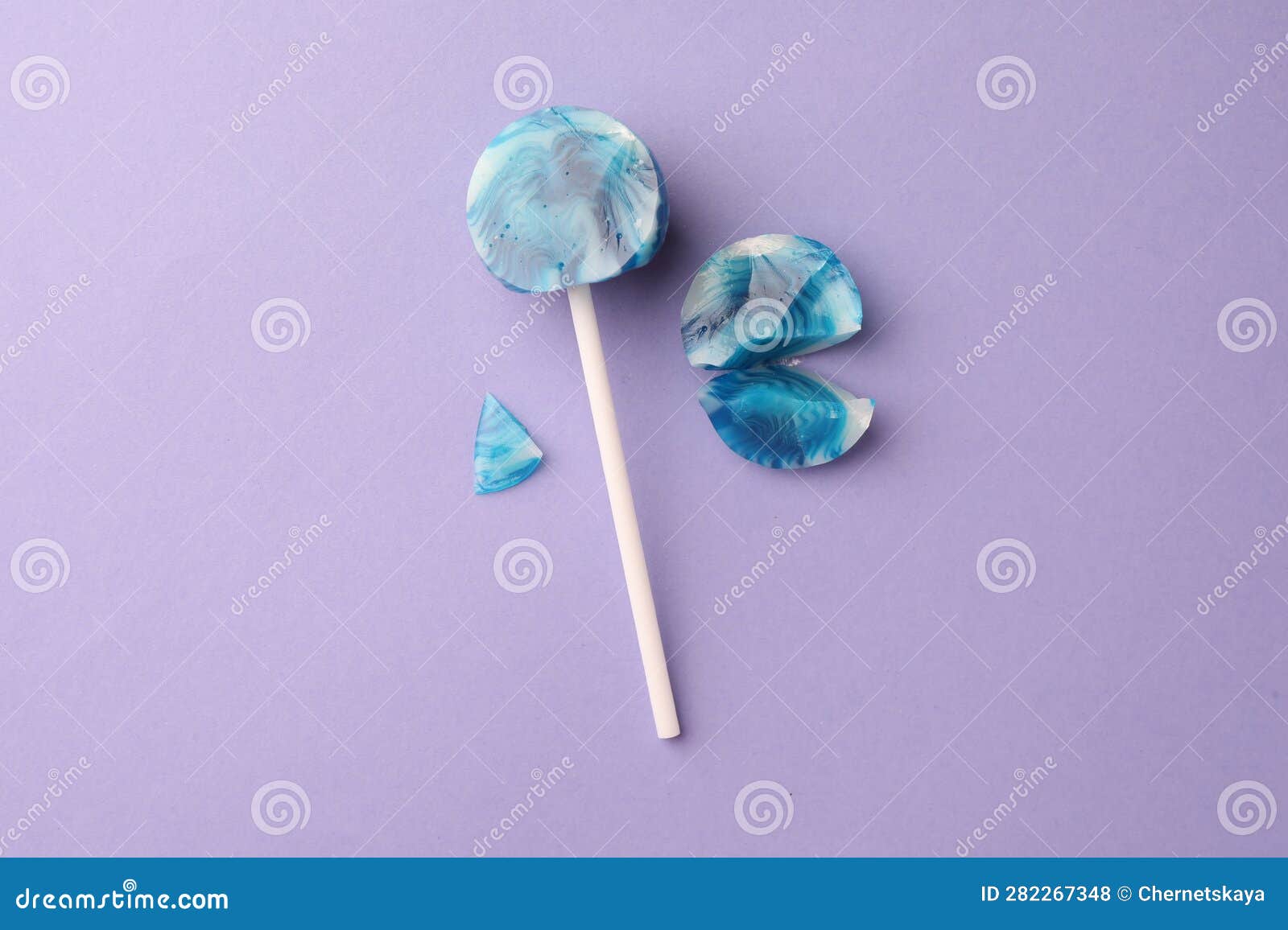Broken Lollipop on Violet Background, Flat Lay Stock Photo - Image of ...