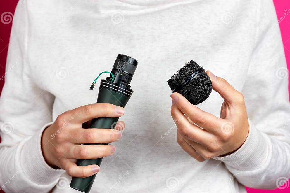 Broken Microphone in Hand. Broken Mesh Microphone Stock Photo - Image ...