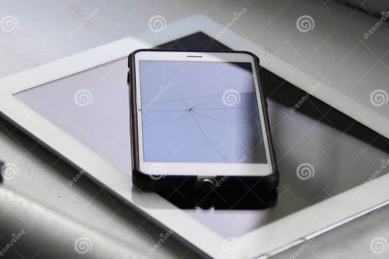 Colored Highlights of a Broken Mobile Phone Screen in the Reflection of ...