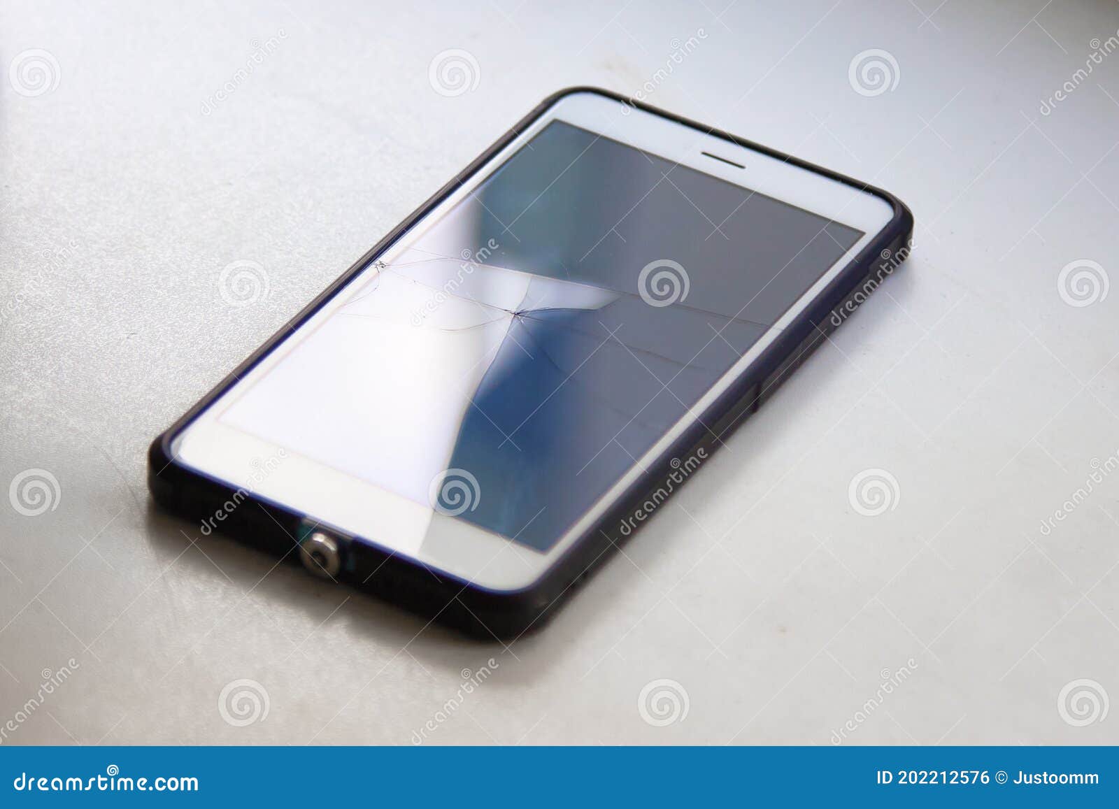 Colored Highlights of a Broken Mobile Phone Screen in the Reflection of ...