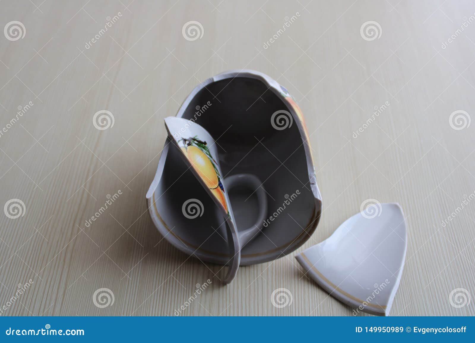 Broken Mug with Fragments on the Table. Stock Image - Image of table ...