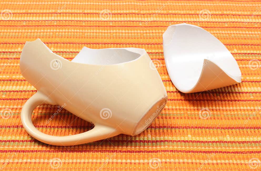 Broken Mug, Shattered Cup on Orange Cloth Stock Image - Image of broken ...