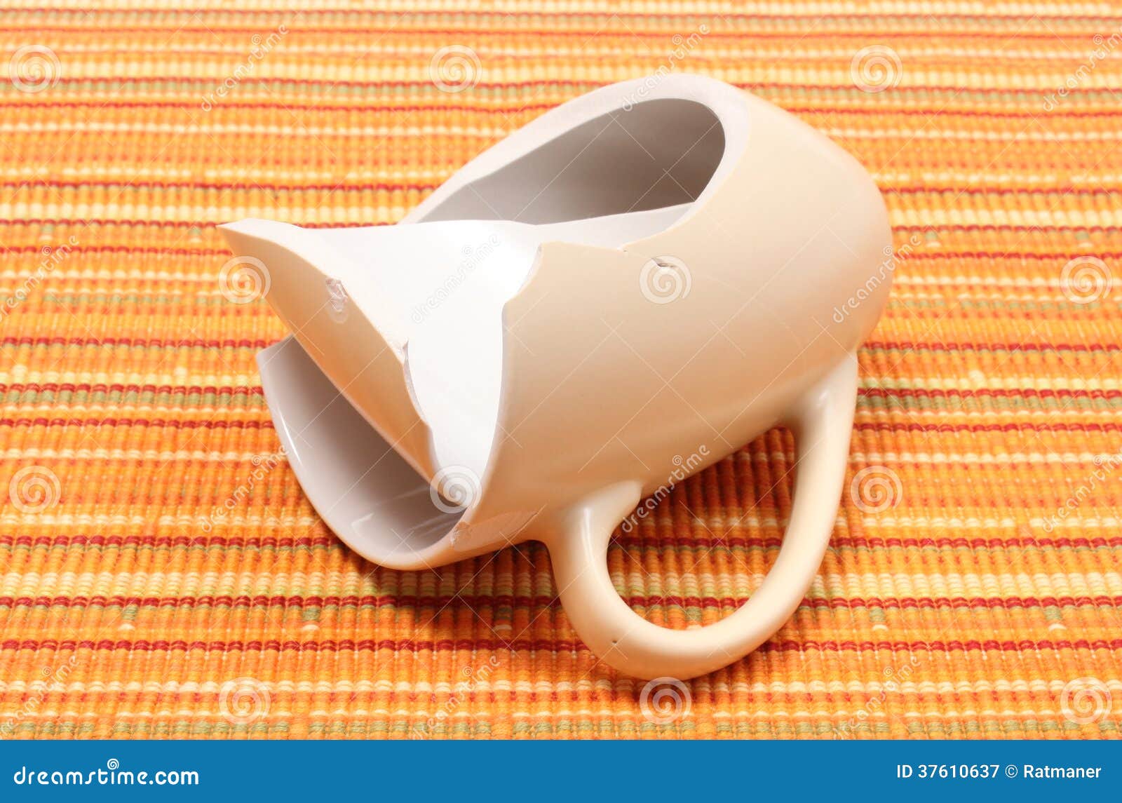 Broken Mug, Shattered Cup on Orange Cloth Stock Image - Image of ...