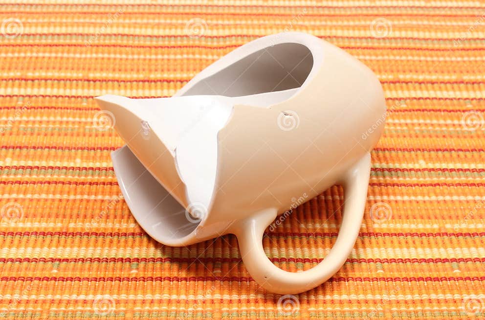 Broken Mug, Shattered Cup on Orange Cloth Stock Image - Image of ...