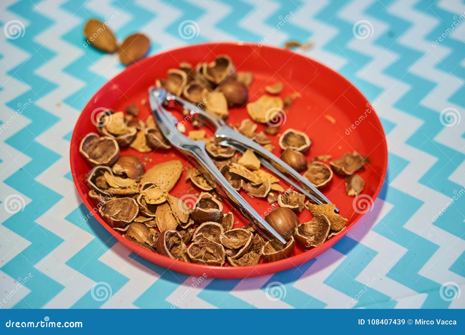 Broken nuts and cracker stock image. Image of table - 108407439