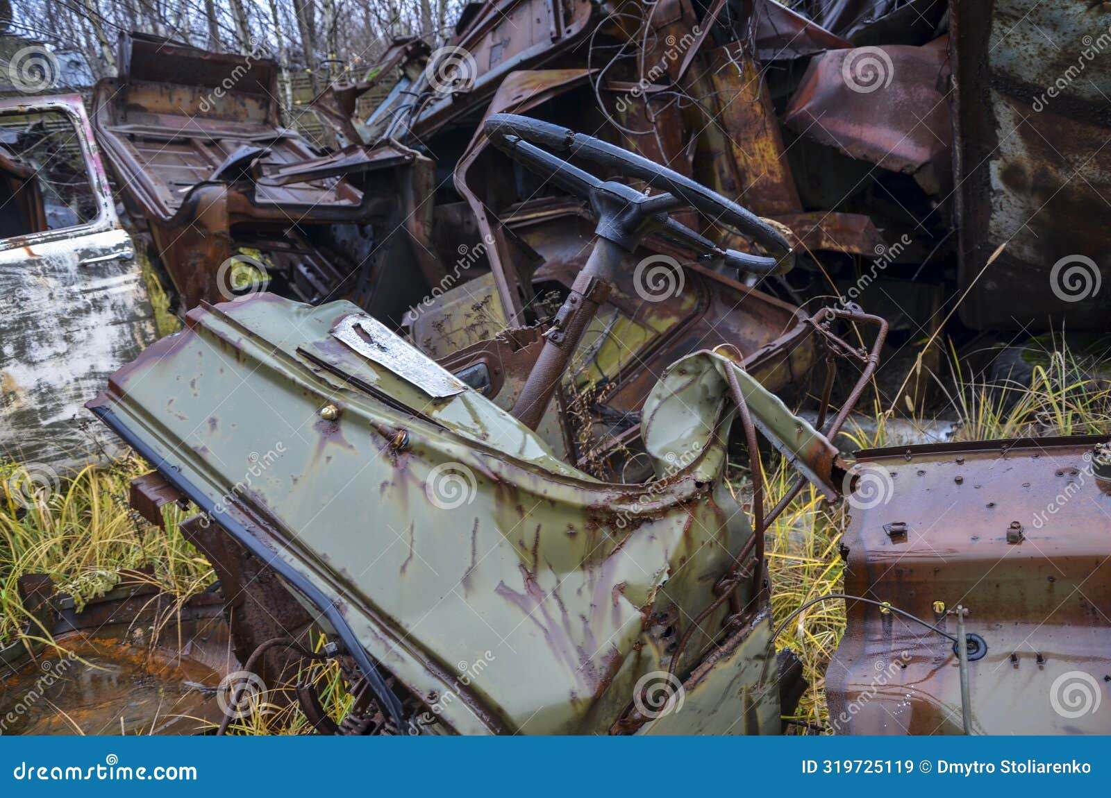 The Broken Old Motor Car Steering Wheel in a Scrap Yard Stock Image ...