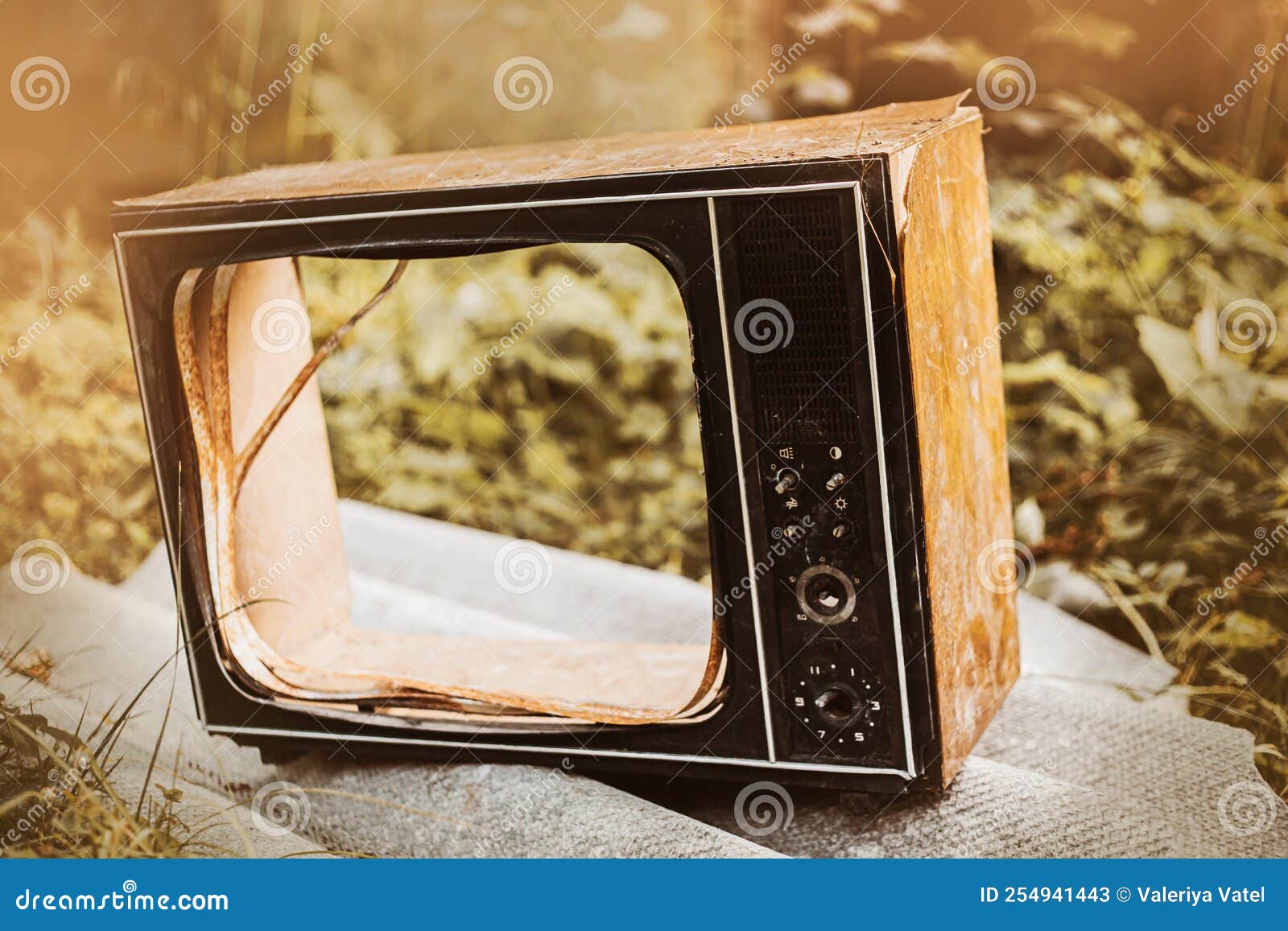 A Broken Old Retro TV with a Broken Screen is Lying in the Trash. the ...